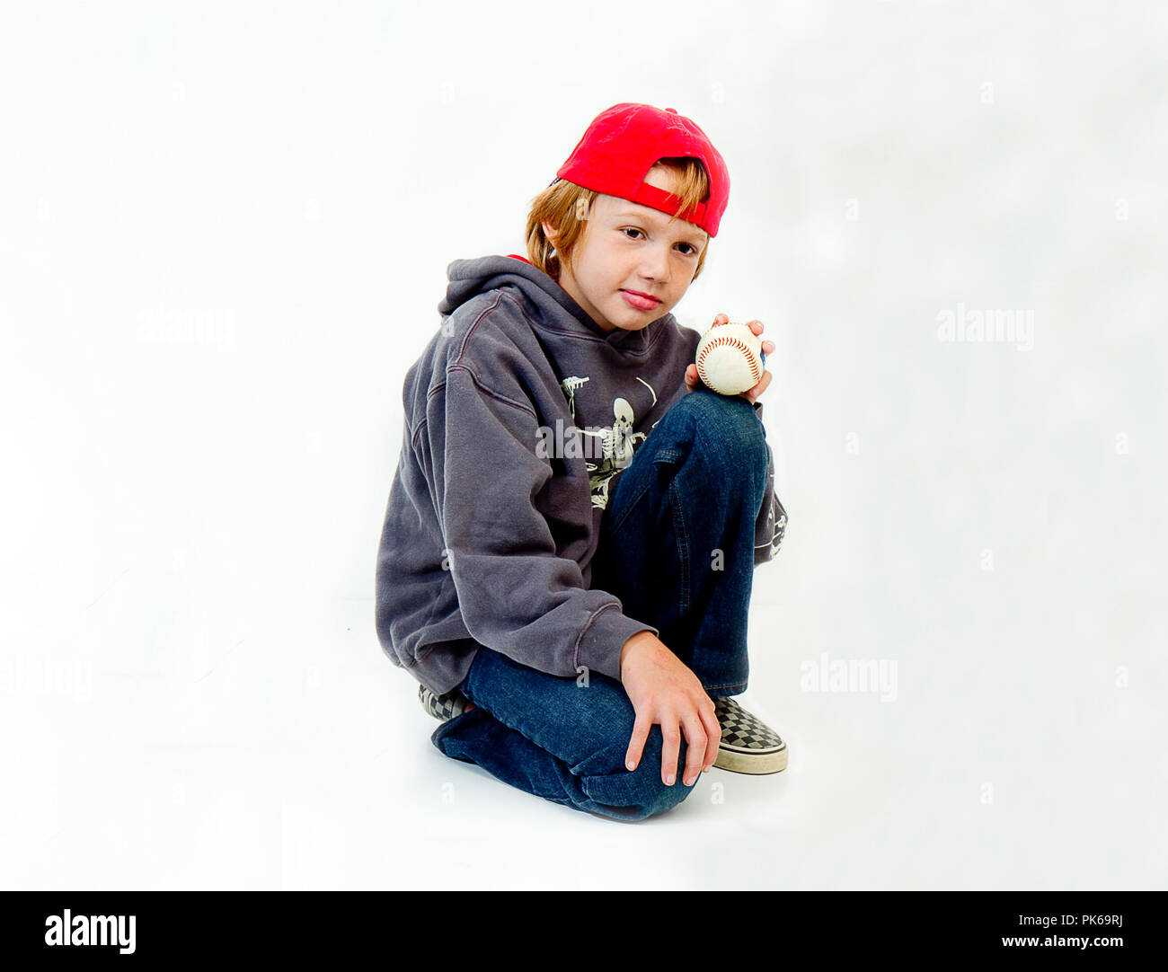 Young boy in baseball cap posing, isolated on white background Stock ...