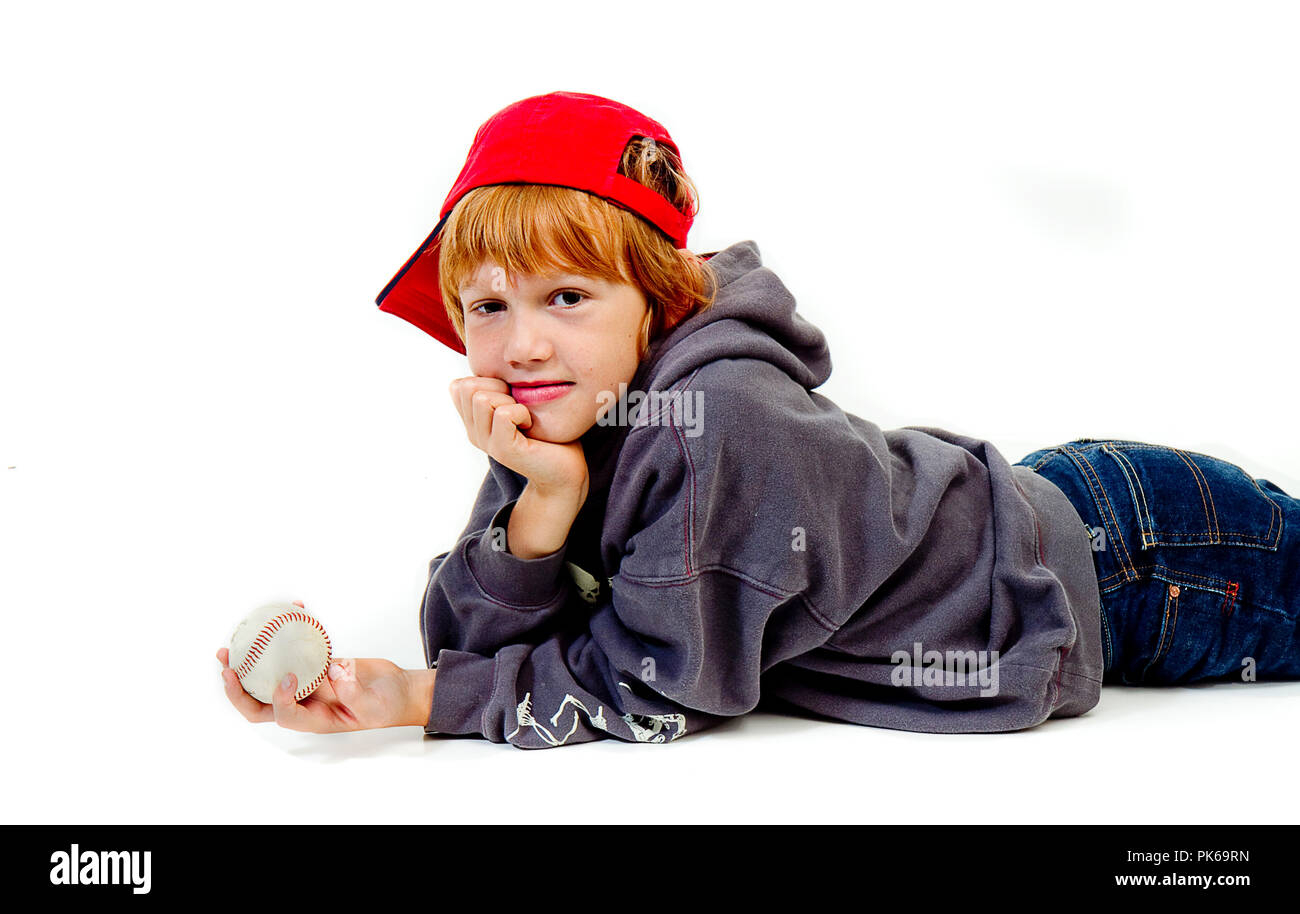 Young boy in baseball cap posing, isolated on white background Stock ...