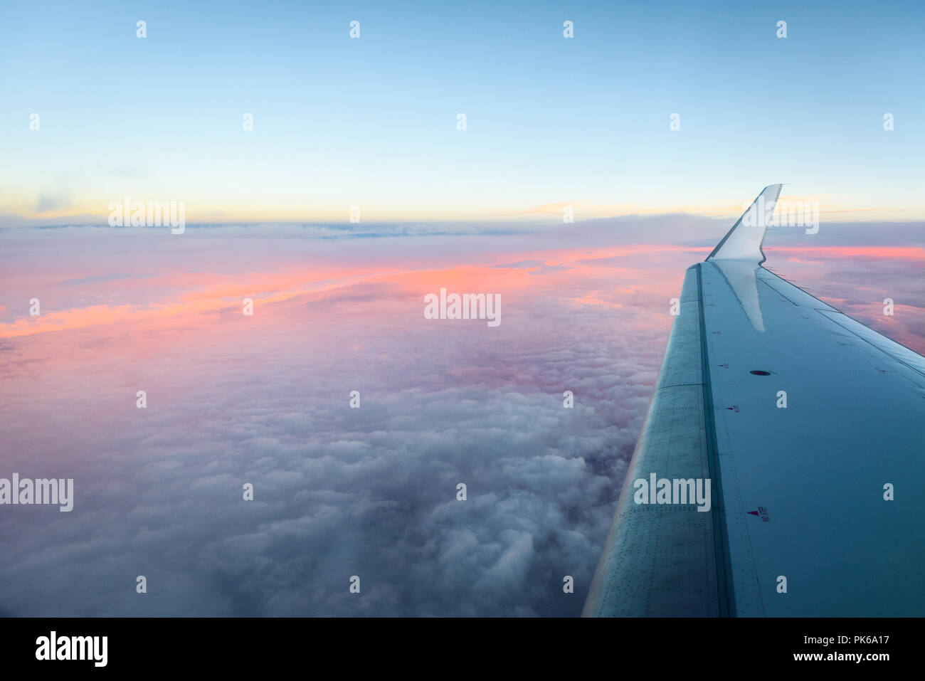 Looking trough aircraft window at the airplane wing. View from plane ...