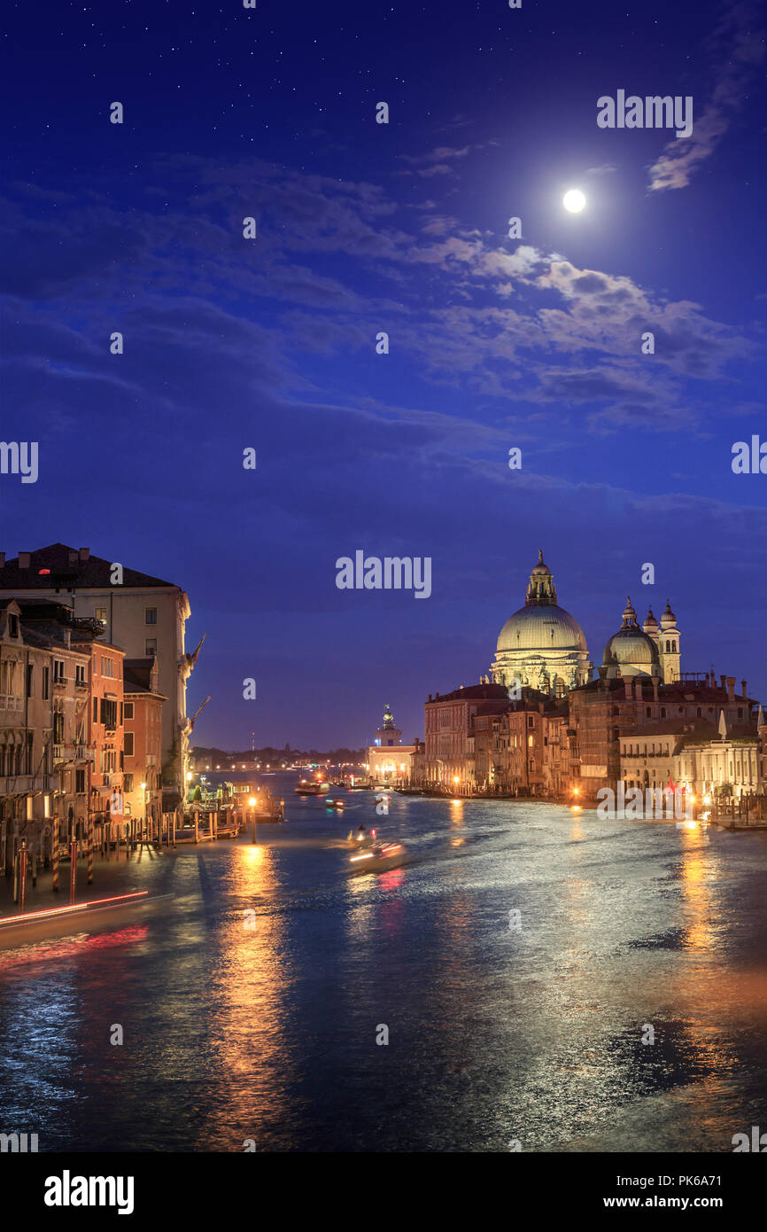The moon shines over Venice. Picture taken from the Academy bridge ...