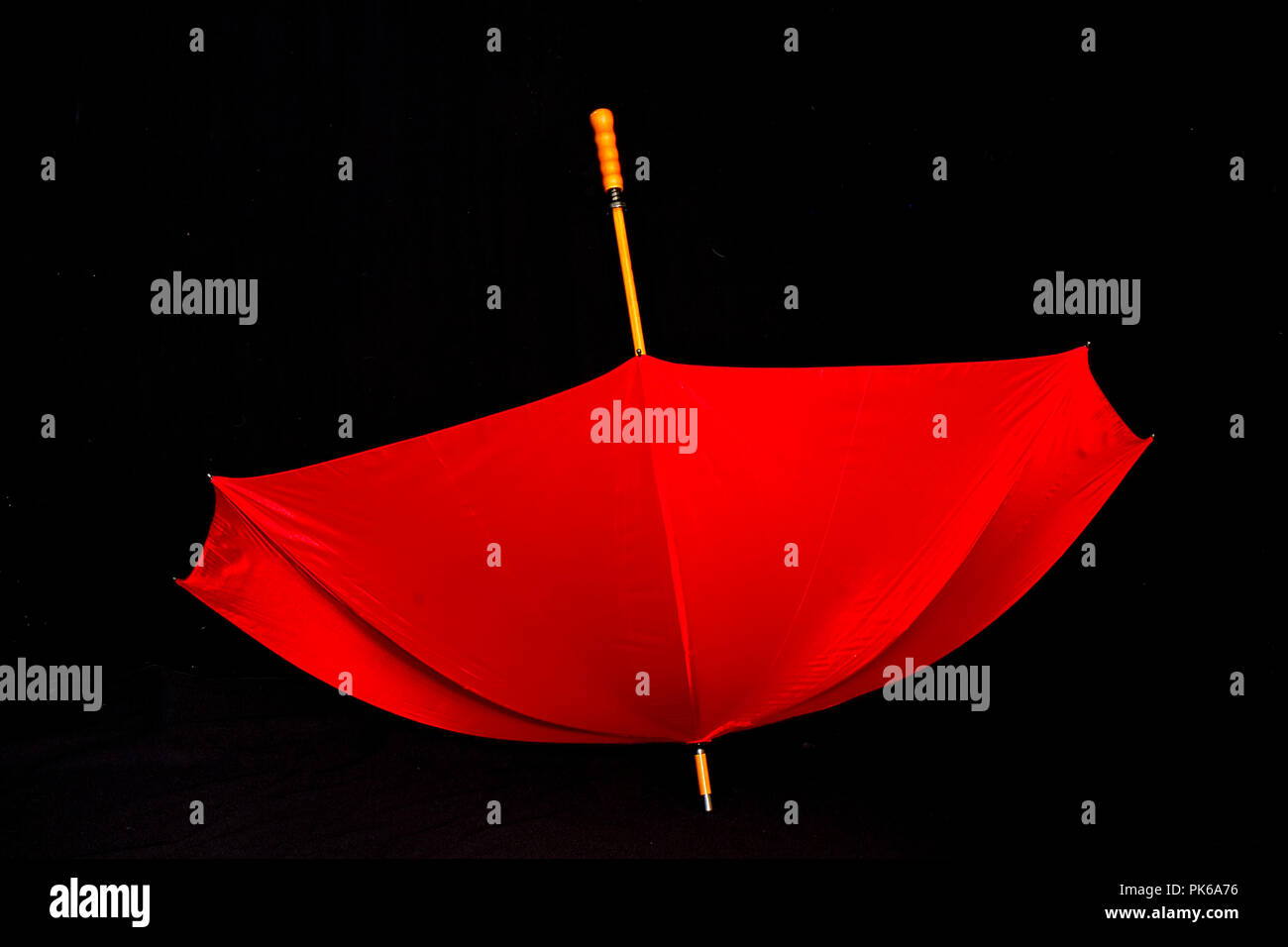 Large Red Umbrella opened up. White and Black backgrounds, Some with ...