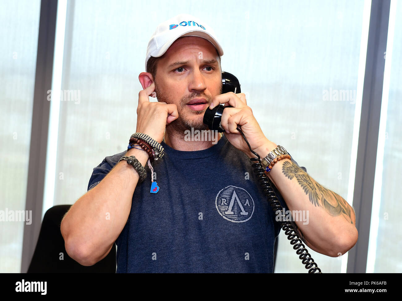 Tom hardy attending 14th bgc annual charity day canary wharf hi-res ...