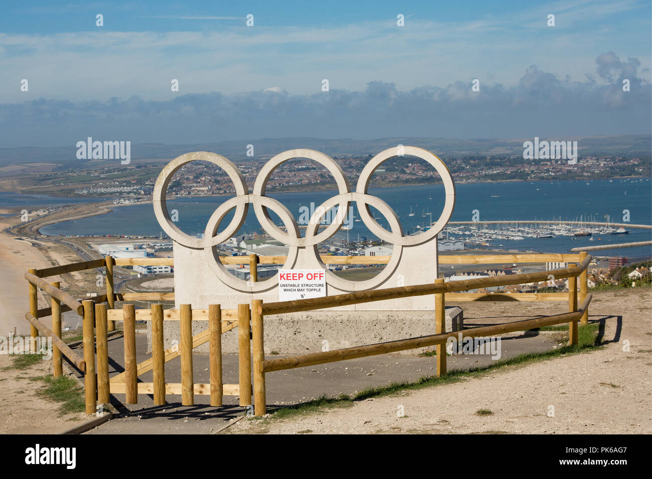 A stone sculpture of the Olympic rings on the Isle of Portland against ...