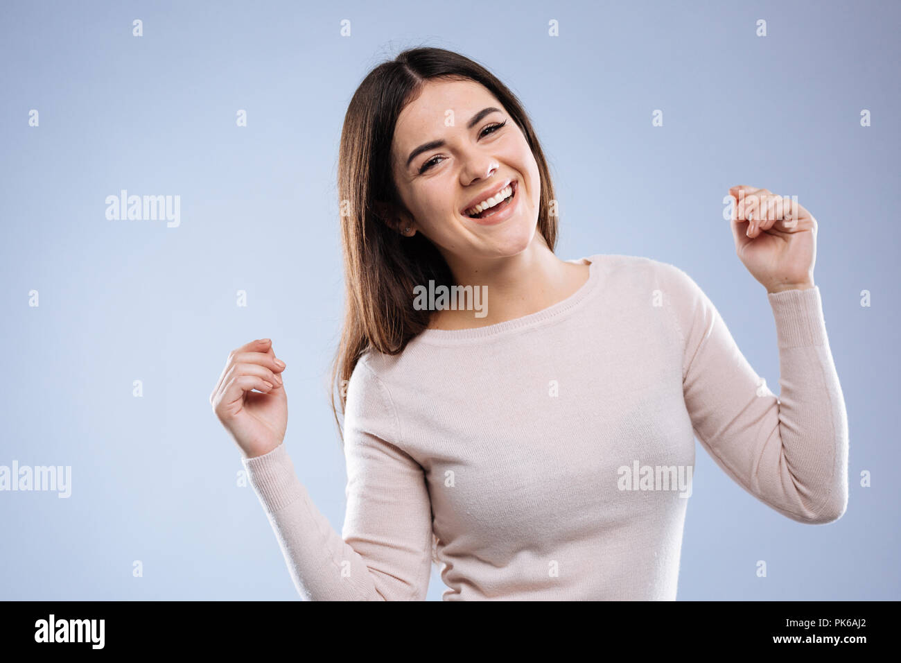 Nice positive joyful woman feeling very happy Stock Photo - Alamy