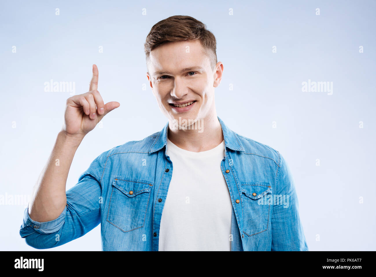 Delighted happy smart man having an idea Stock Photo - Alamy