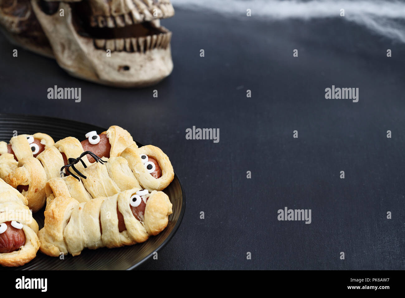 Fun food for kids. Halloween mummy hot dogs. Wieners wrapped in ...
