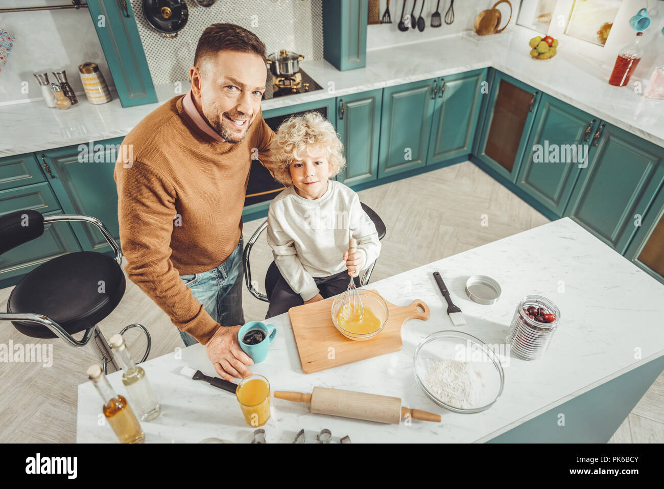 Caring loving father and son making breakfast for their family Stock ...
