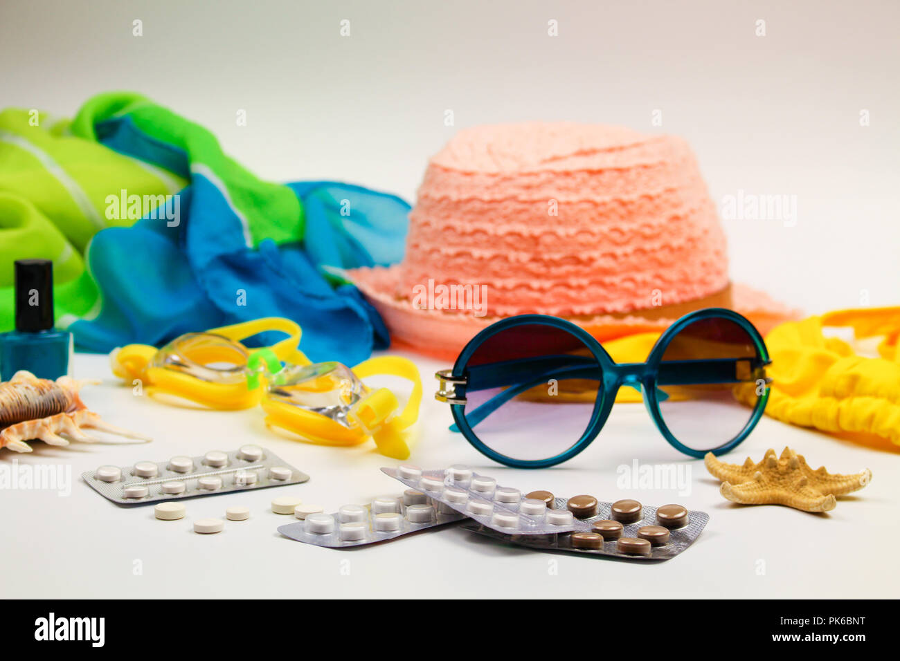 Summer women's beach accessories for your sea holiday and pill on white ...