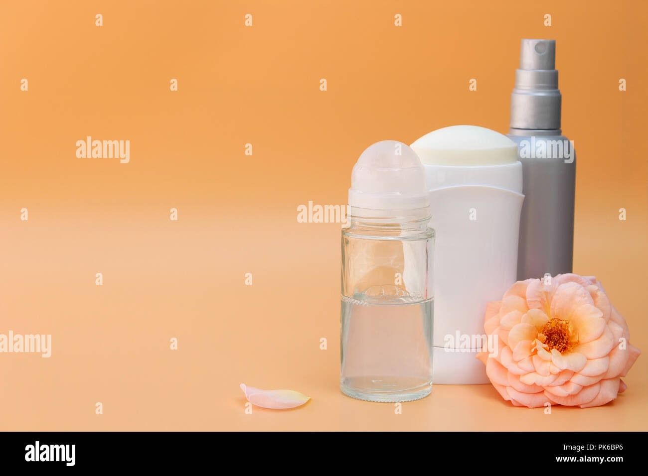Different deodorants on beige background Stock Photo - Alamy