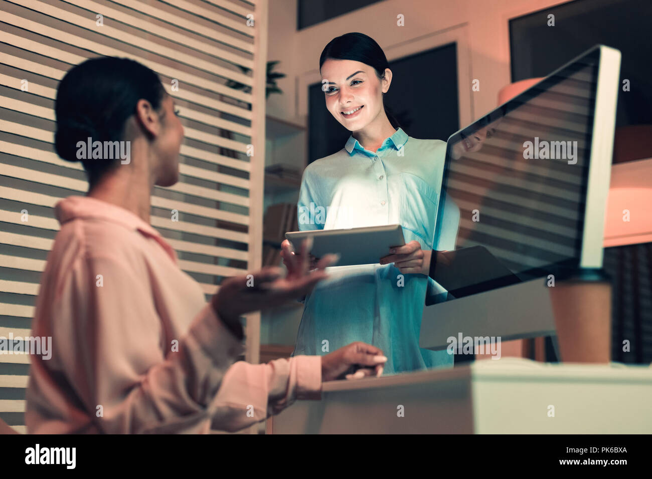 Woman asking colleague advice hi-res stock photography and images - Alamy