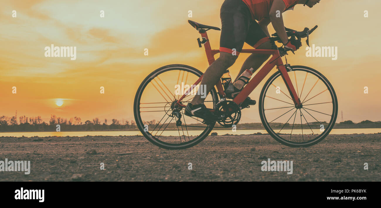 A cyclist riding a road bike on road in the moring Stock Photo - Alamy