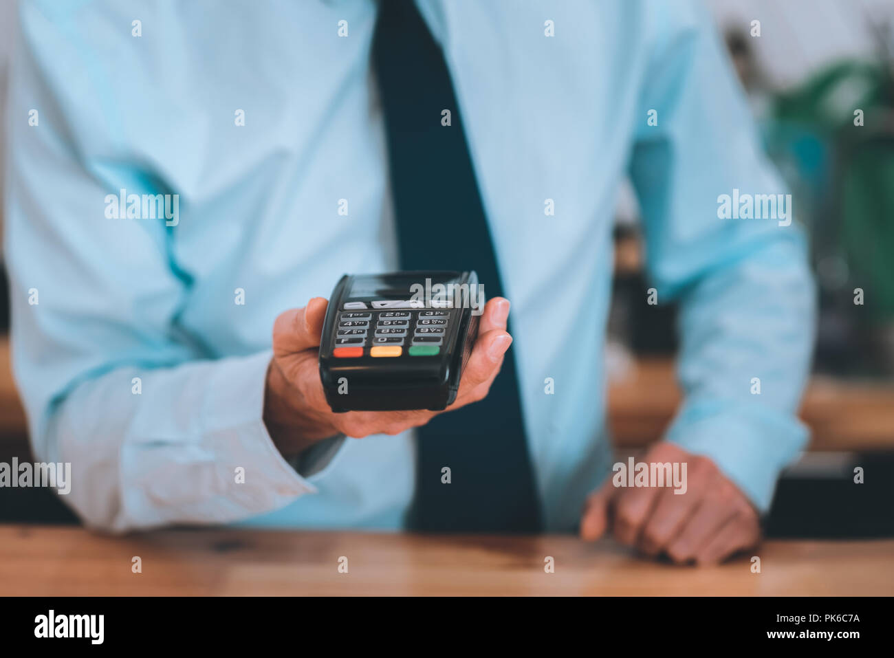 Close up of male hand that holding terminal Stock Photo - Alamy