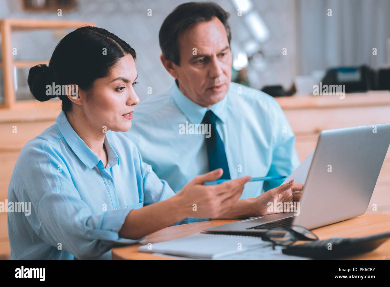 Serious colleagues preparing project presentation Stock Photo - Alamy