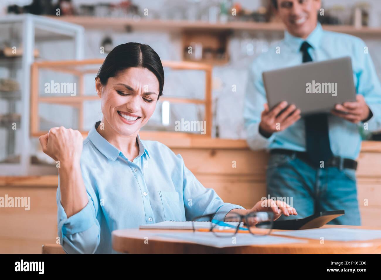 Amazing office worker celebrating her success Stock Photo - Alamy