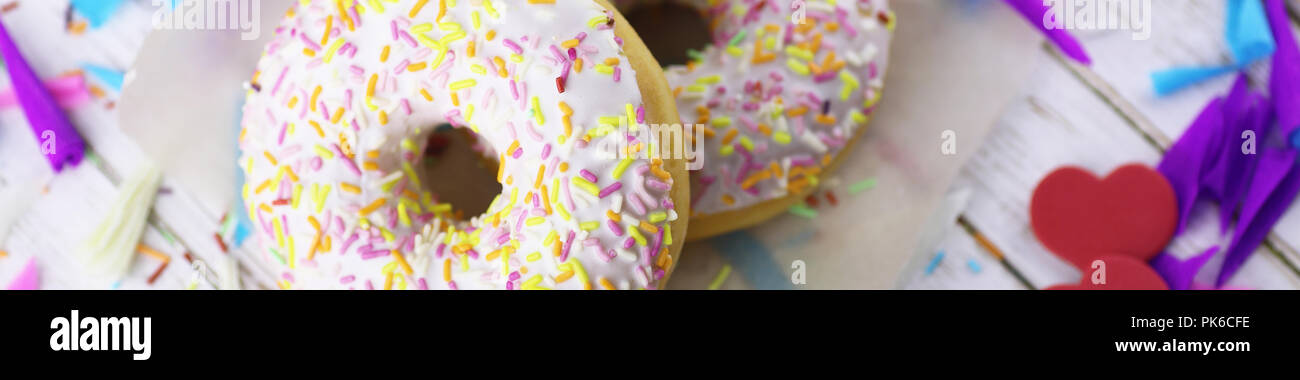 Horizontal bakground of donuts on a wooden Stock Photo - Alamy