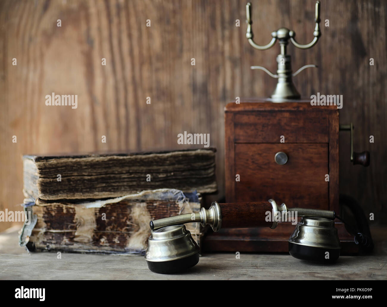 Old telephone and retro book on a wood Stock Photo - Alamy