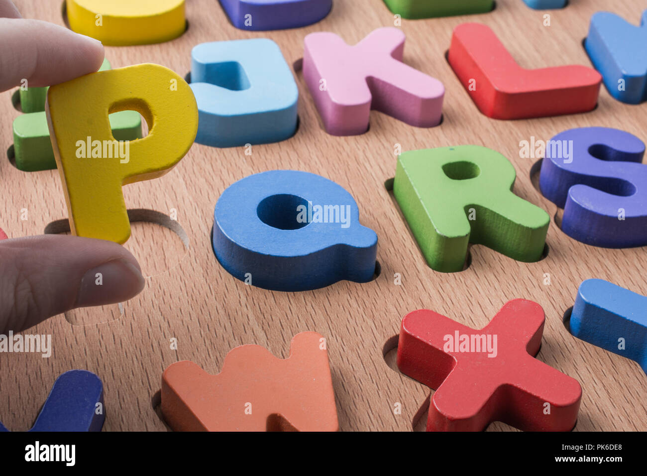 Letter P and Colorful letters on board on white background Stock Photo ...