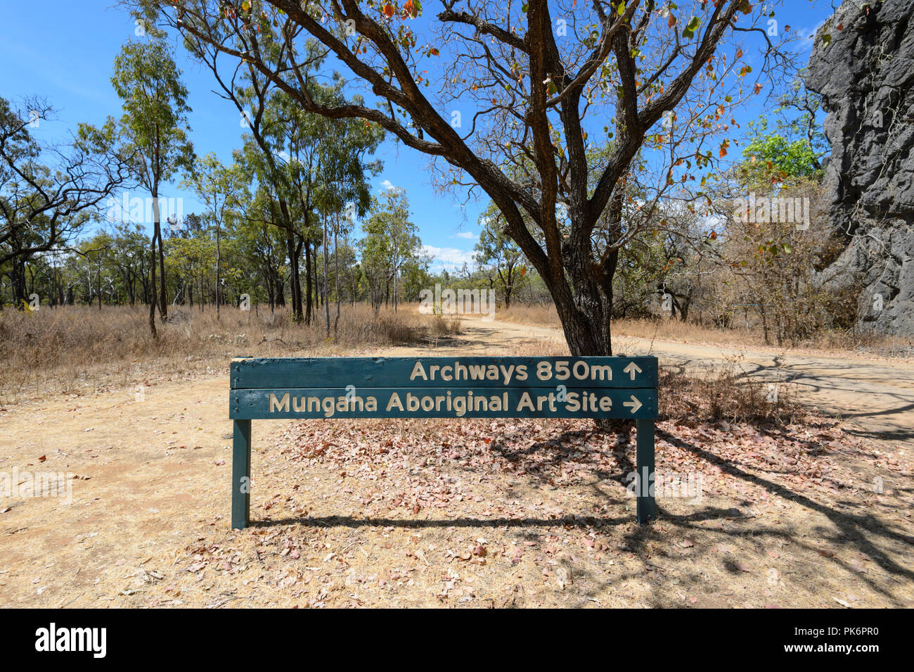Signs indicating direction to Mungana Aboriginal Art Site and Archways ...