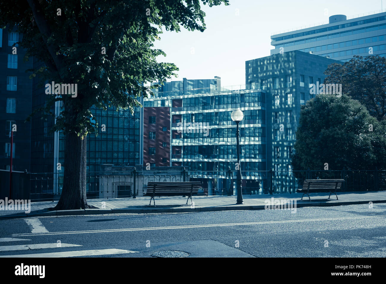 modern office glass window building with green trees Stock Photo - Alamy