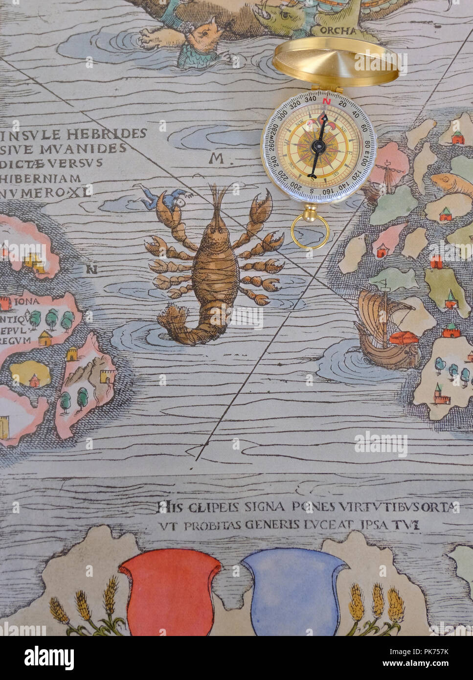 Compass placed on top of reproduction of section of Olaus Magnus's 16th ...