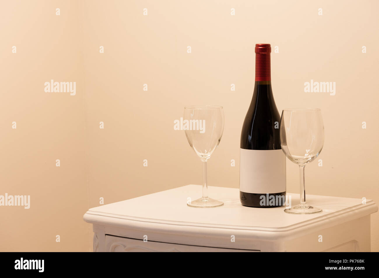 Wine bottle with wine glasses in a bedroom. Room service at the hotel ...