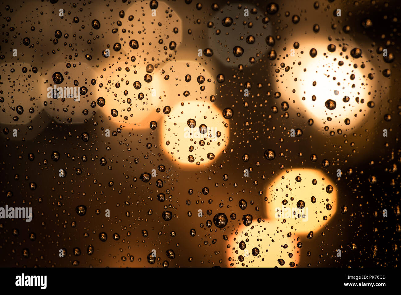 Drops of rain on window with abstract night city lights Stock Photo - Alamy