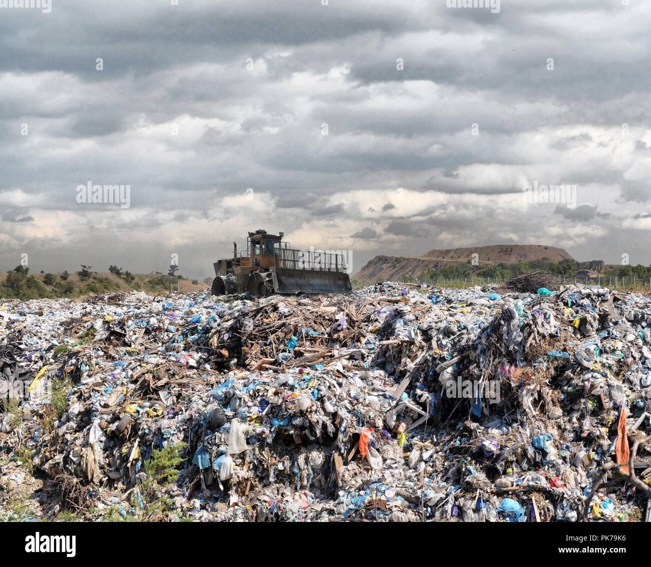 bulldozer buries food and industrial wastes Stock Photo - Alamy