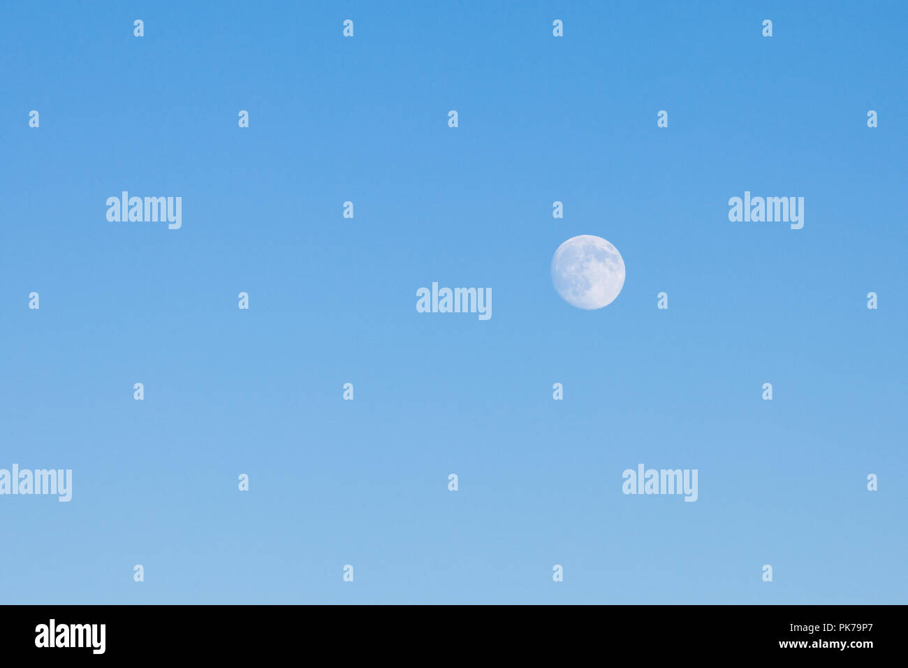 Full moon in blue sky. Nature background Stock Photo - Alamy