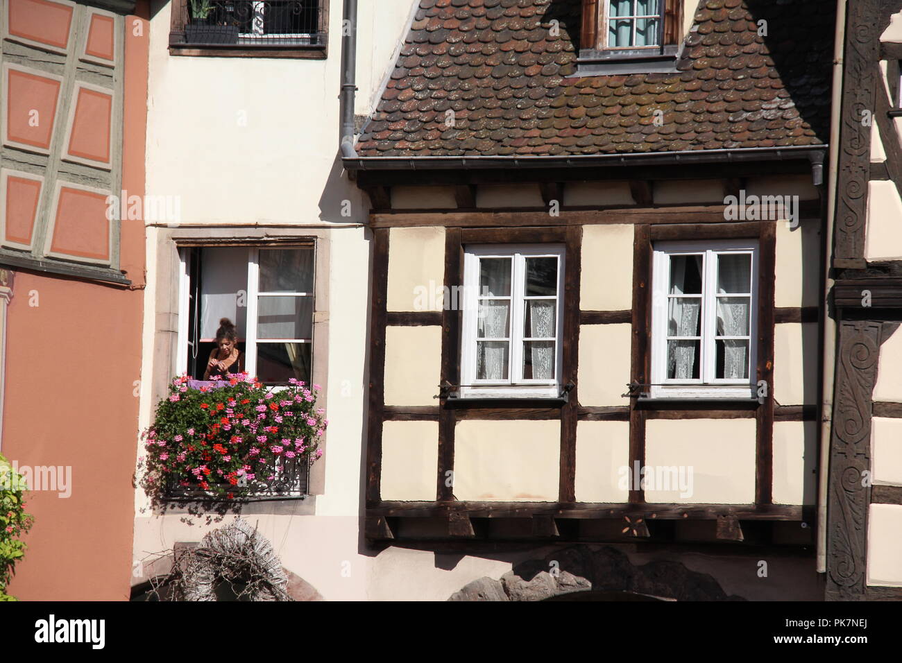 People enjoying the summer sun in the town of Colmar in the Alsace ...