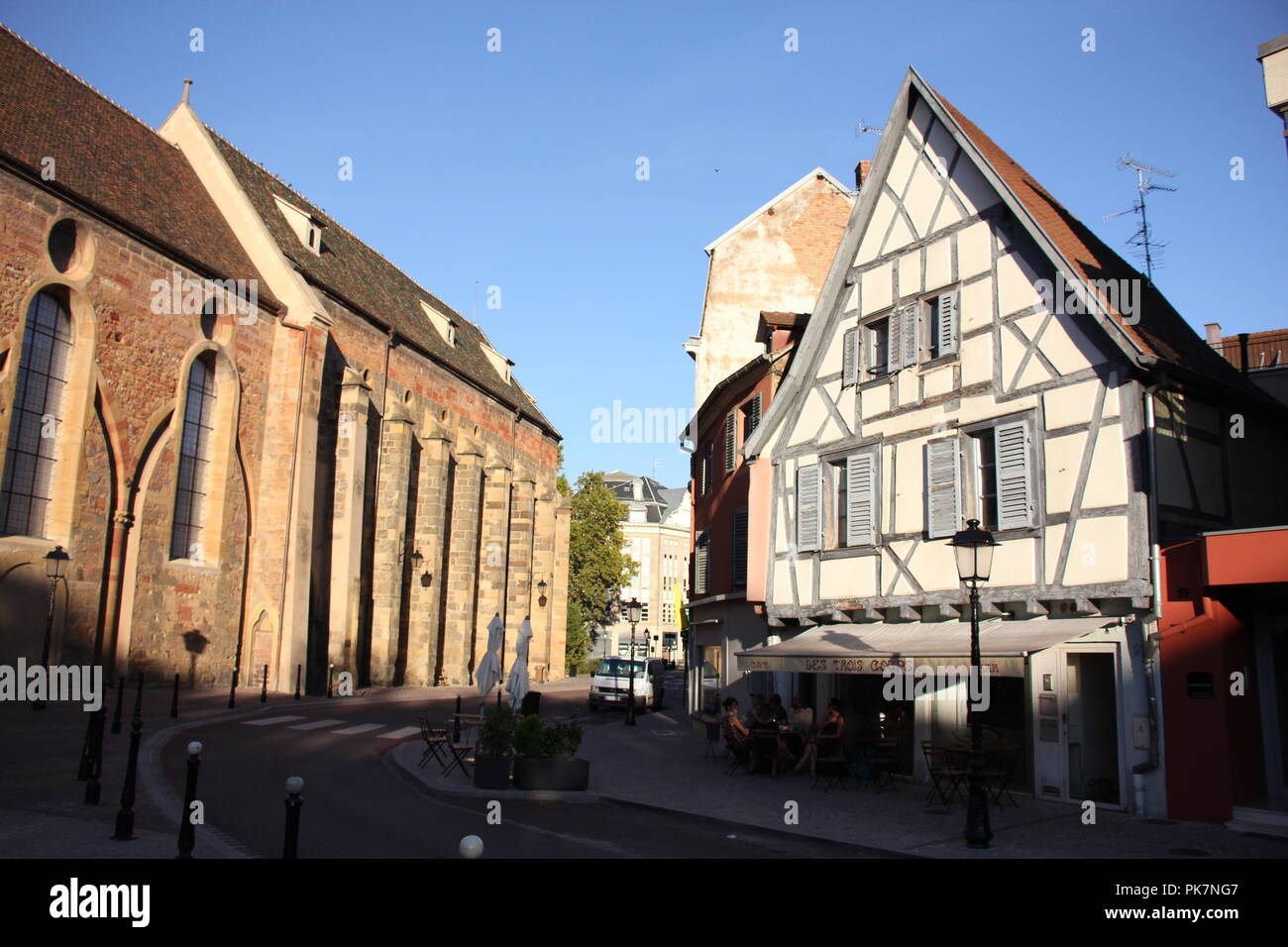 People enjoying the summer sun in the town of Colmar in the Alsace ...
