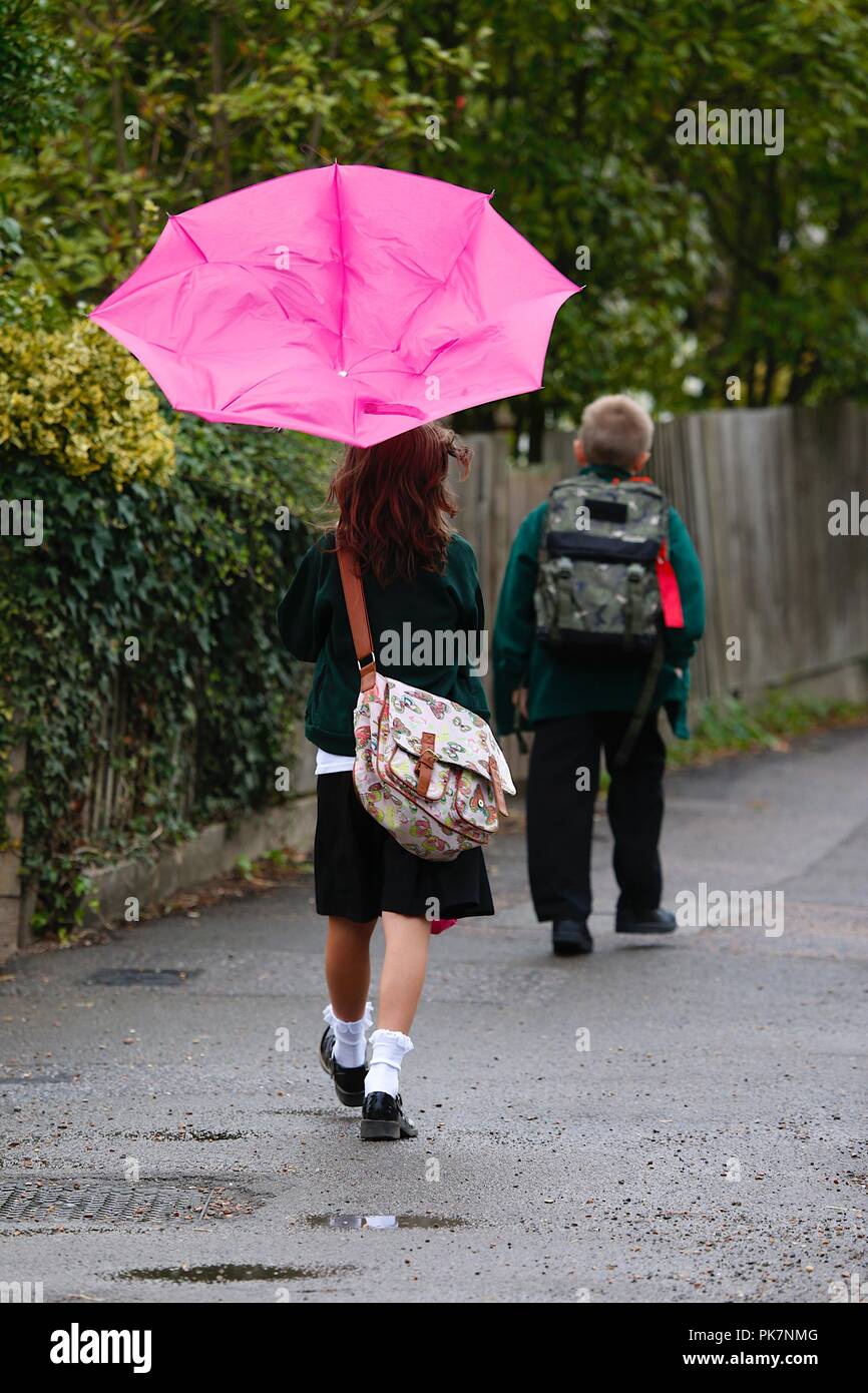 Children walking school in rain hi-res stock photography and images - Alamy