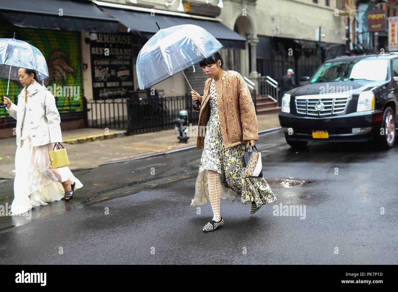 Blogger Susie Lau posing on the street during New York Fashion Week ...
