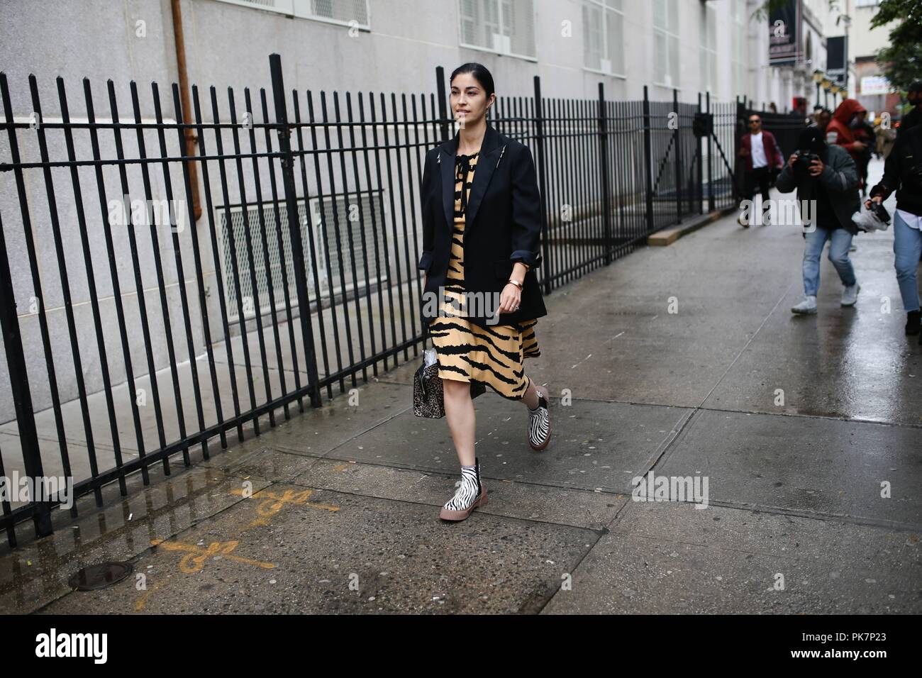 Caroline Issa, Editor at Tank Magazine, posing on the street during New ...