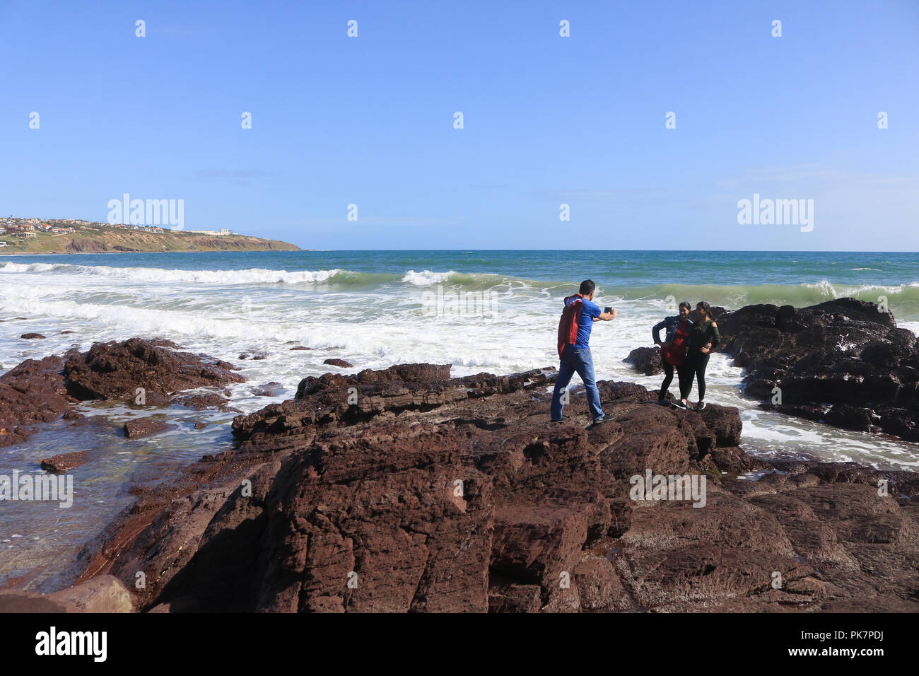 Adelaide, Australia. 12th Sep, 2018. People stand on the erratic rocks ...