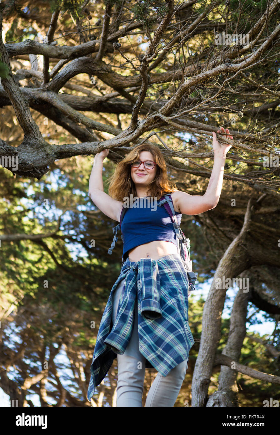 Woman climbing a tree hi-res stock photography and images - Alamy