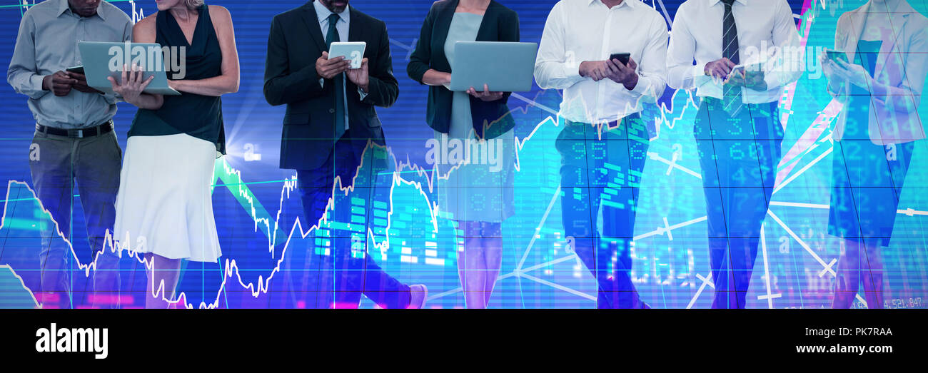 Composite image of business people using technology over white ...