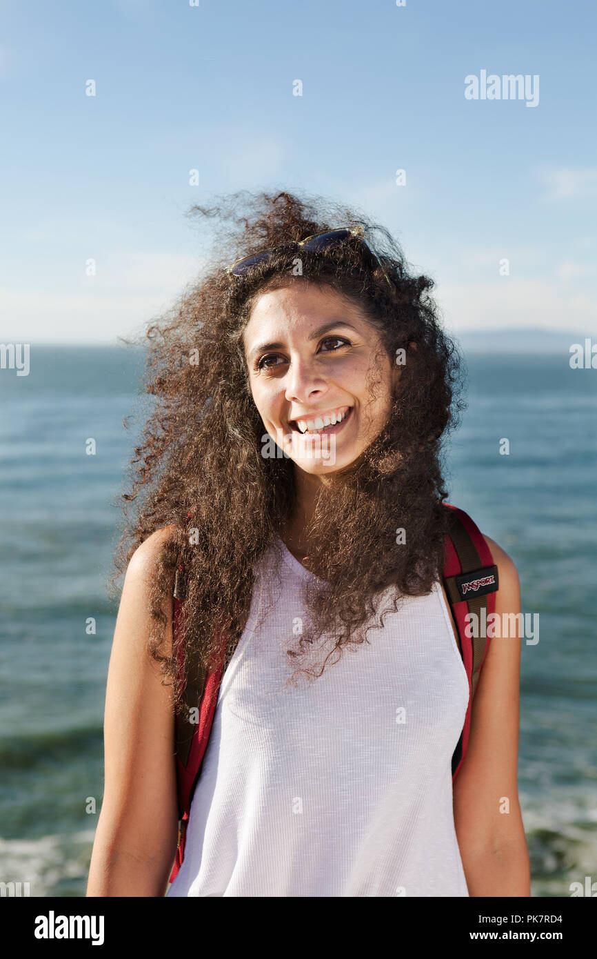 Woman on the Beach Looking Happy Stock Photo - Alamy