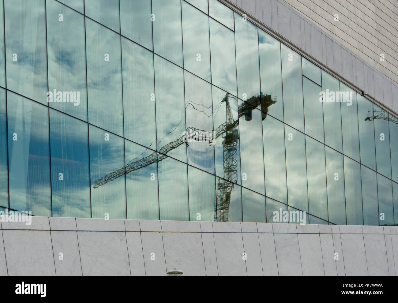 Reflections of continuous construction activity in the windows of the ...