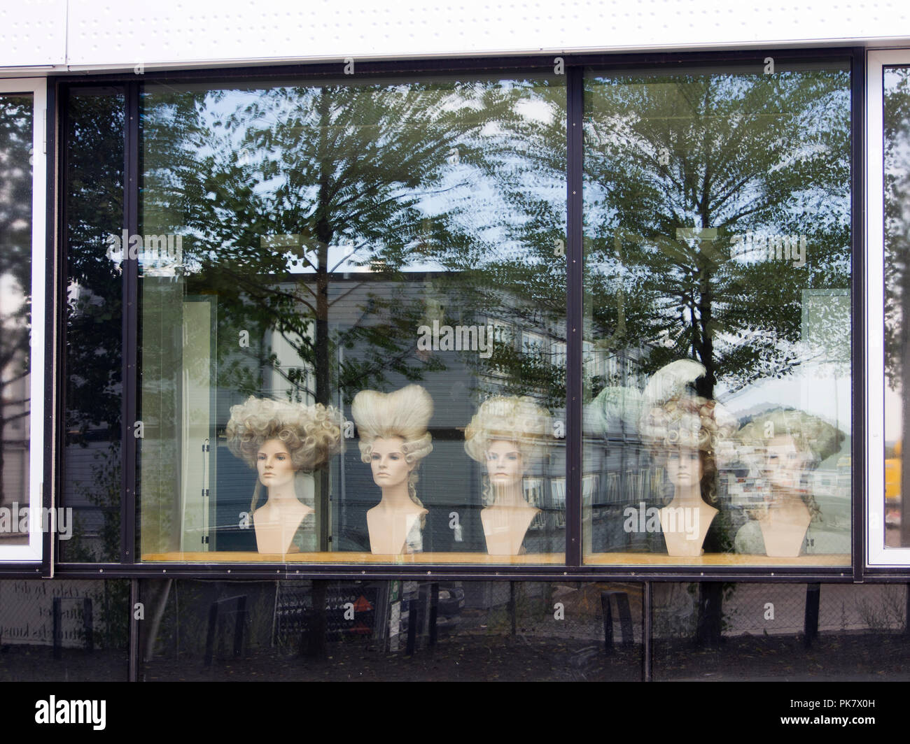 Wigs for various performances on display in a window in the Oslo Opera ...