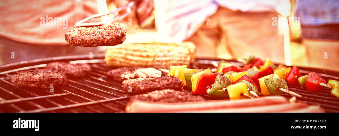 Barbecuing hi-res stock photography and images - Alamy