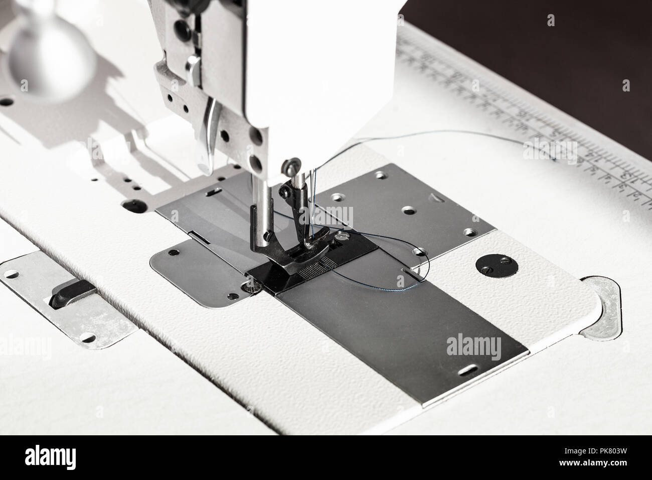 steel presser foot of white industrial sewing machine close up Stock ...
