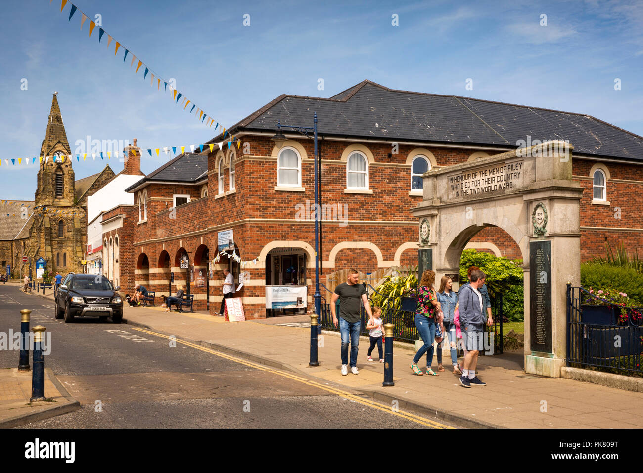 UK, England, Yorkshire, Filey, Murray Street, visitors passing War ...