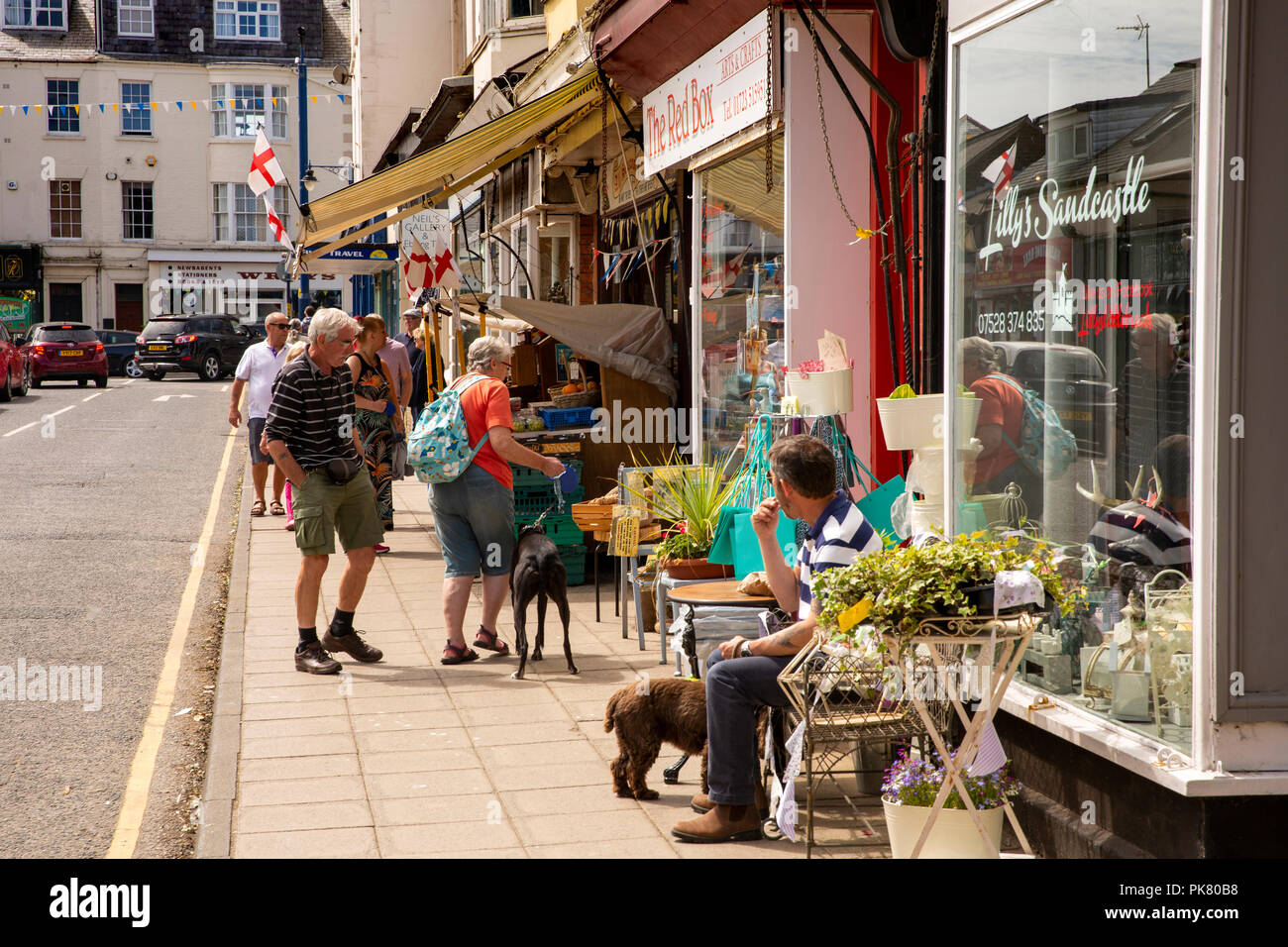 UK, England, Yorkshire, Filey, John Street, visitors looking at shops ...