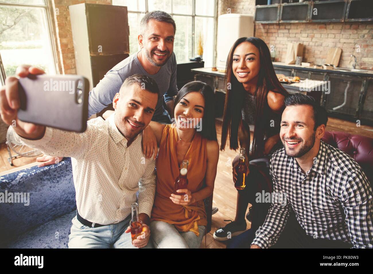 Friends making selfie celebrating hi-res stock photography and images ...