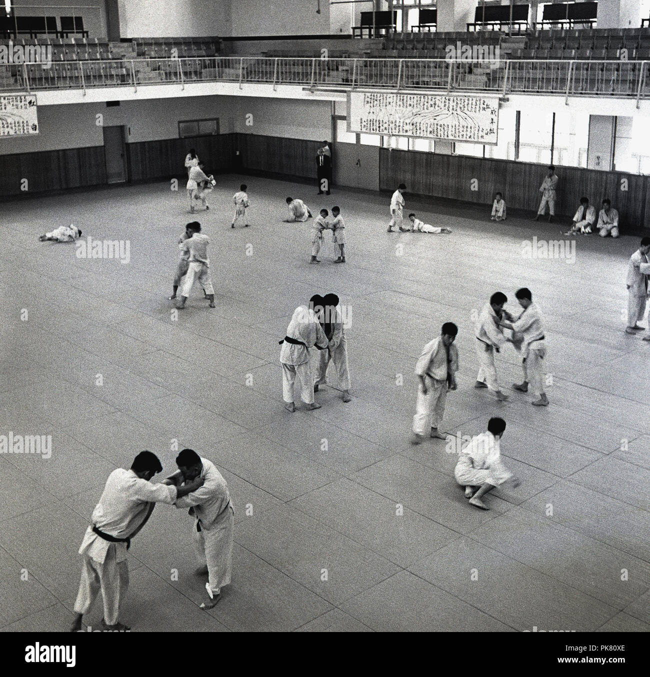 1950s, historical, japanese men doing judo training inside a large ...