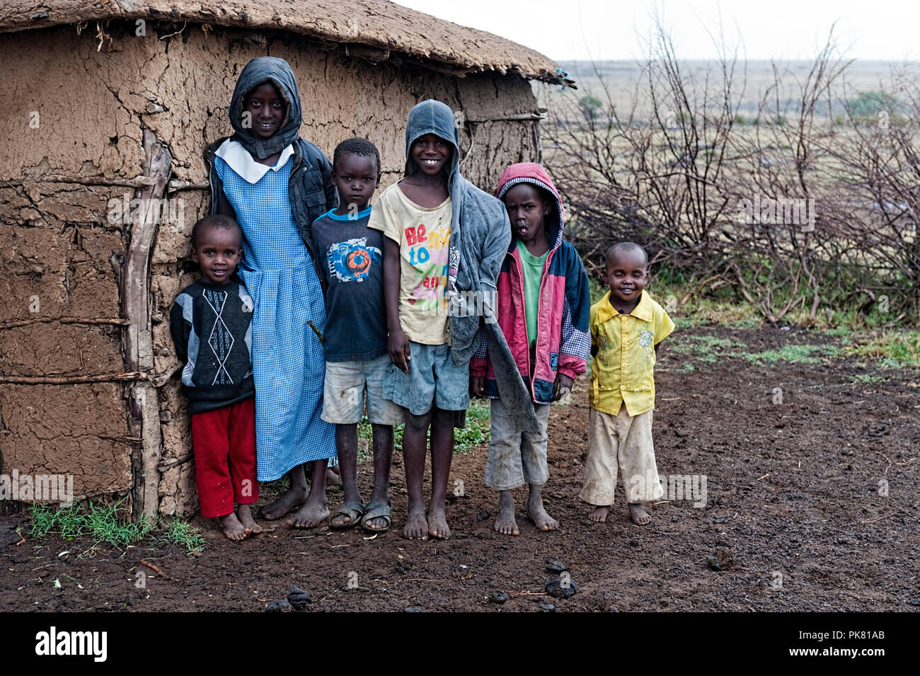 Masai children standing by Manyatta Masai Mara Kenya East Africa Stock ...