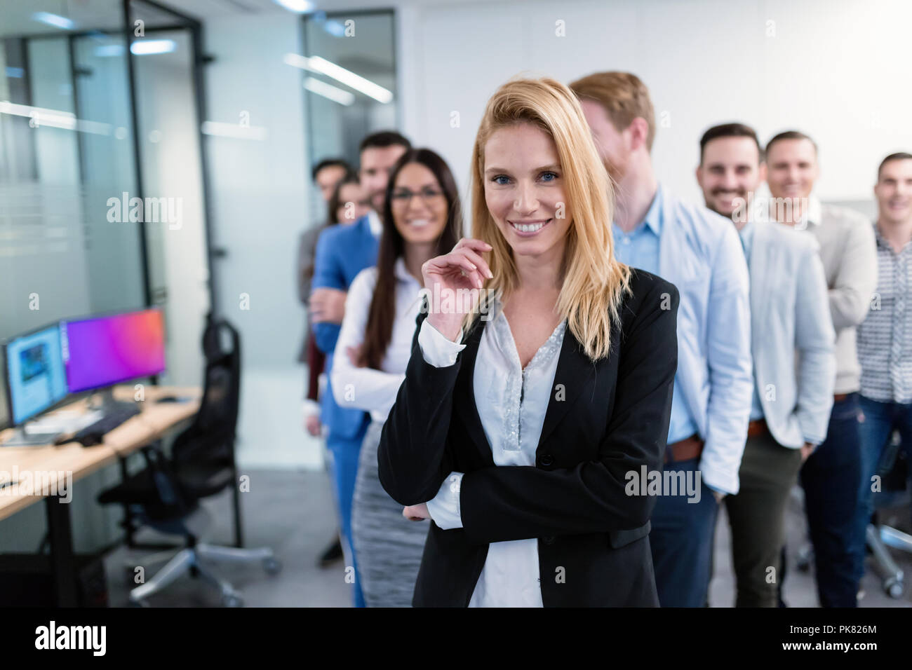 Group picture of business team posing in office Stock Photo - Alamy