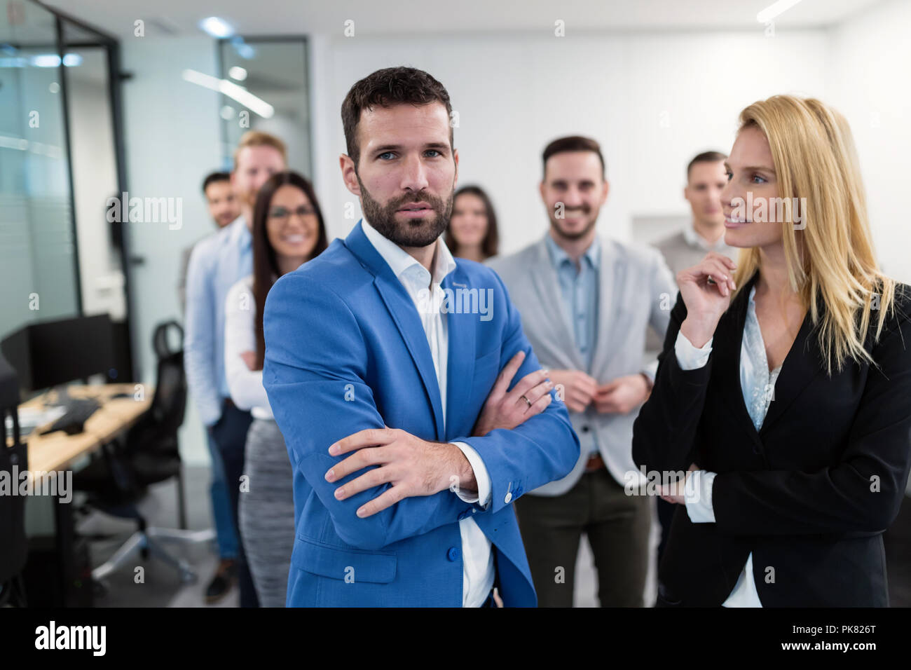 Group picture of business team posing in office Stock Photo - Alamy