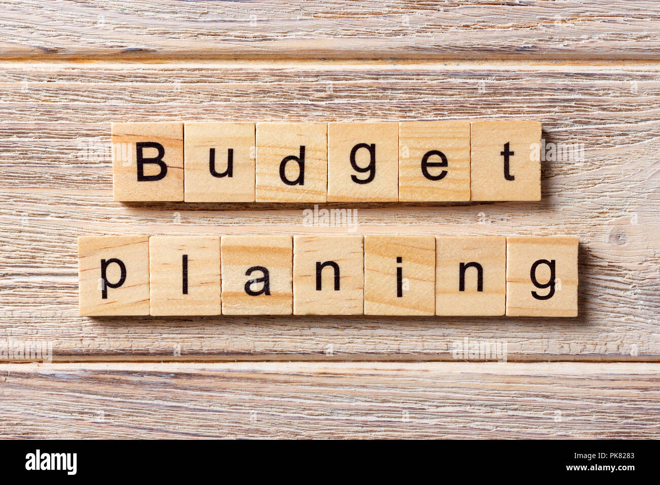 Budget planing word written on wood block. Budget planing text on table ...