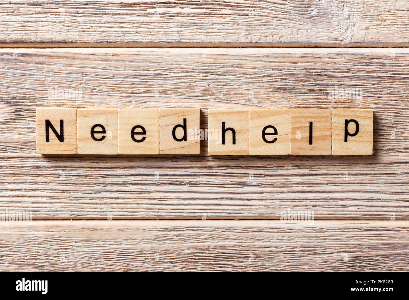 need help word written on wood block. need help text on table, concept ...